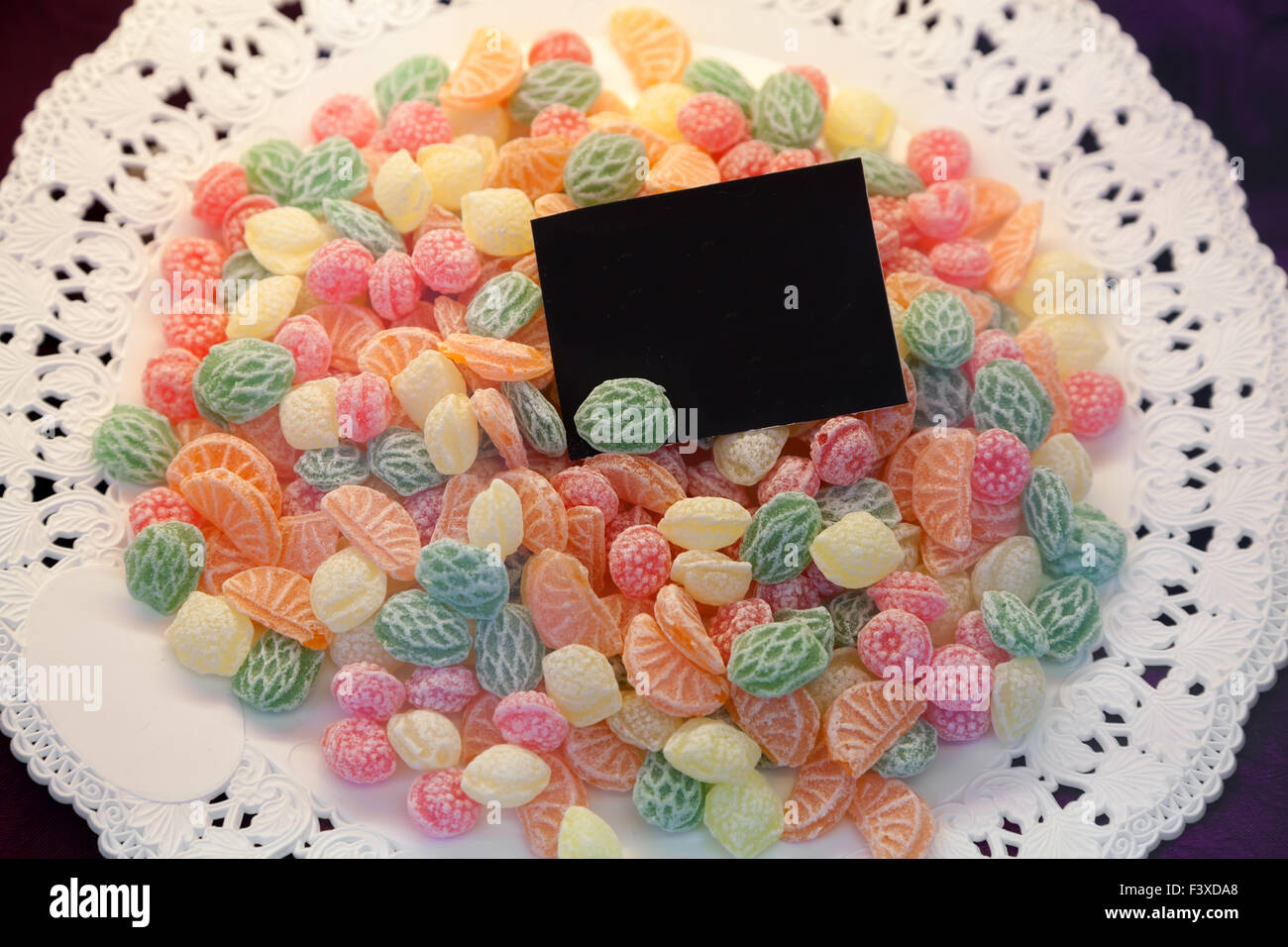 Candy background on the plate Stock Photo - Alamy