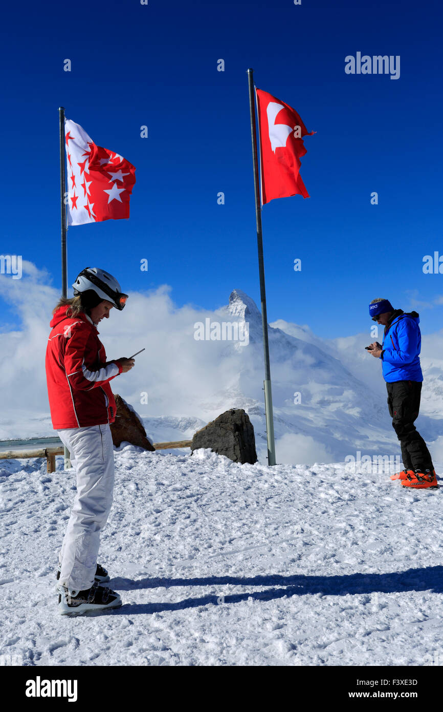 Flag of the Canton du Valais, and the Swiss national flag, Swiss Alps ...