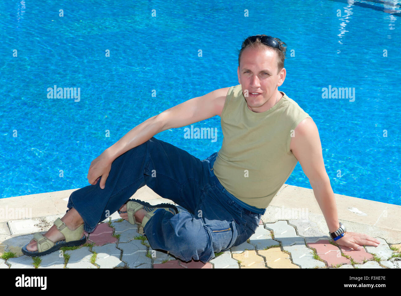 Young sports man at pool Stock Photo - Alamy
