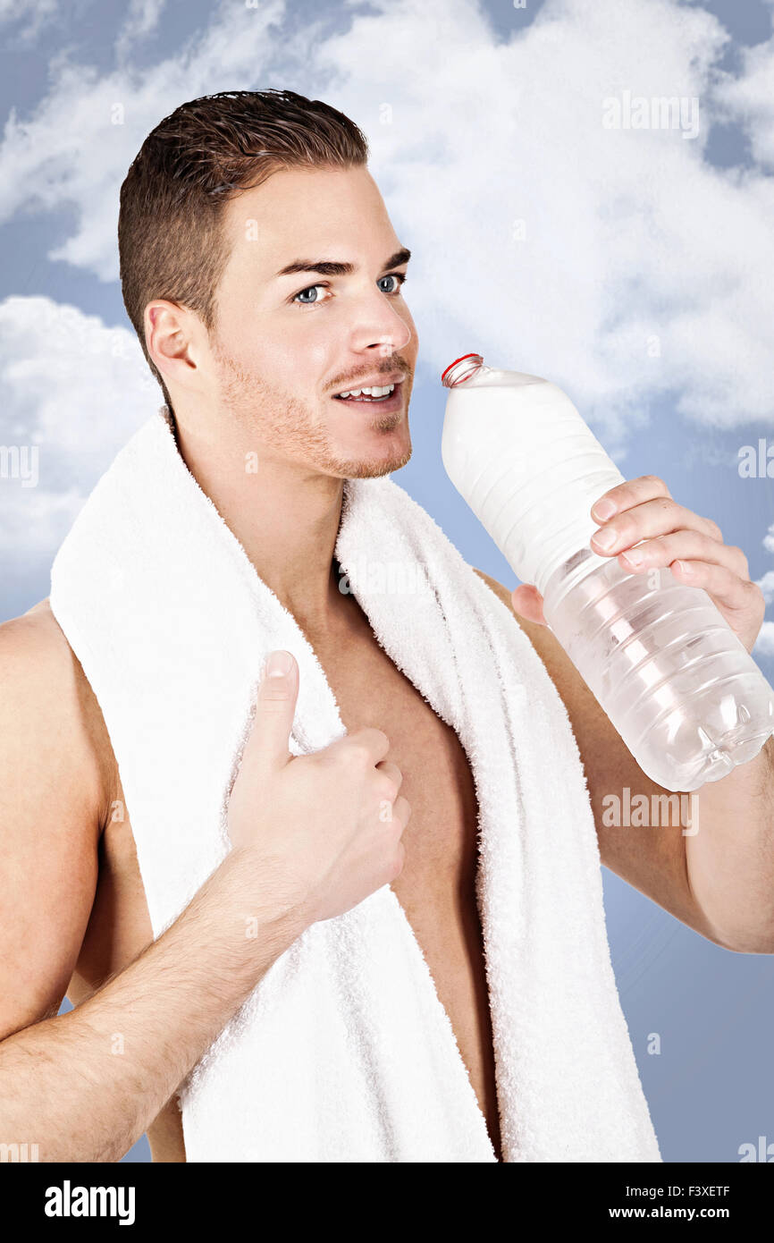 Beautiful man drinking water Stock Photo - Alamy