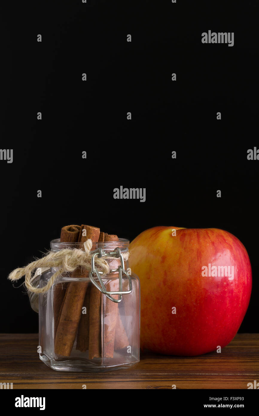 Fresh red apple with cinnamon bark stick Stock Photo - Alamy