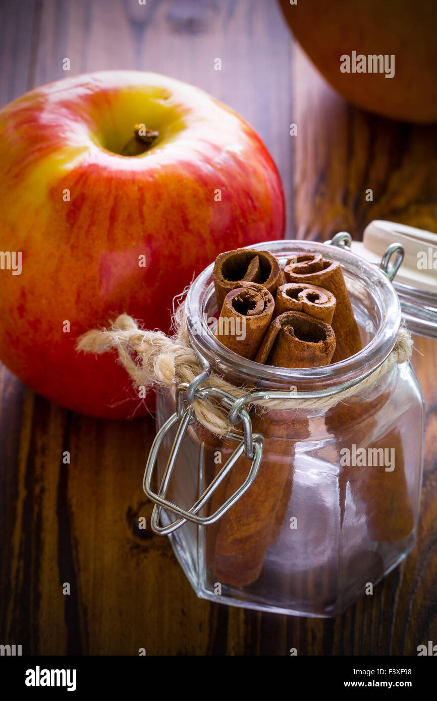 Fresh red apple with cinnamon bark stick Stock Photo - Alamy