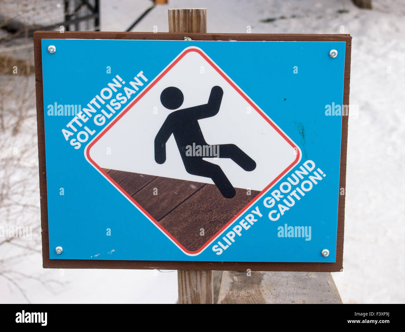 Bilingual caution sign Stock Photo - Alamy