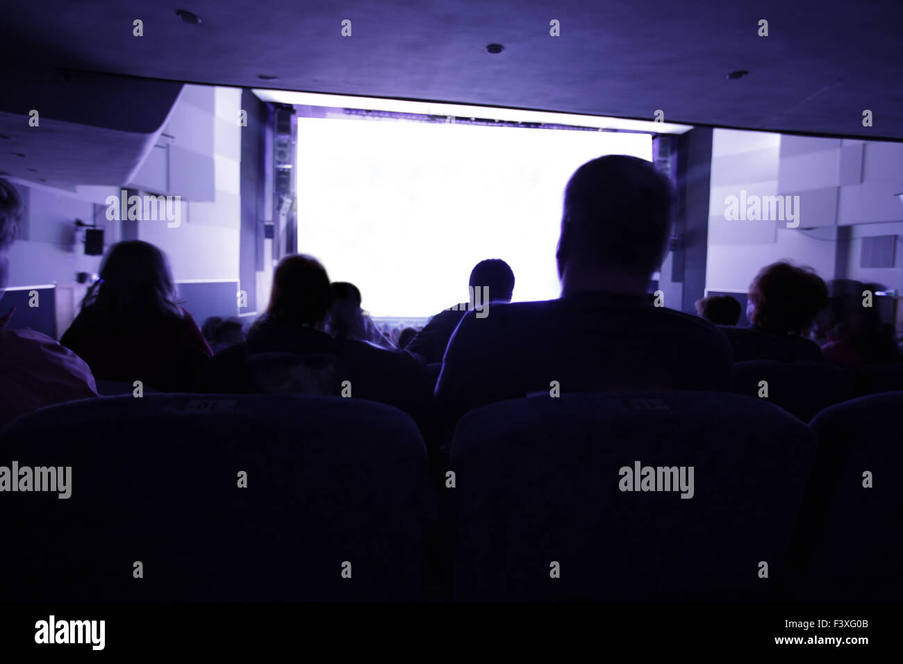 People watching movie Stock Photo - Alamy