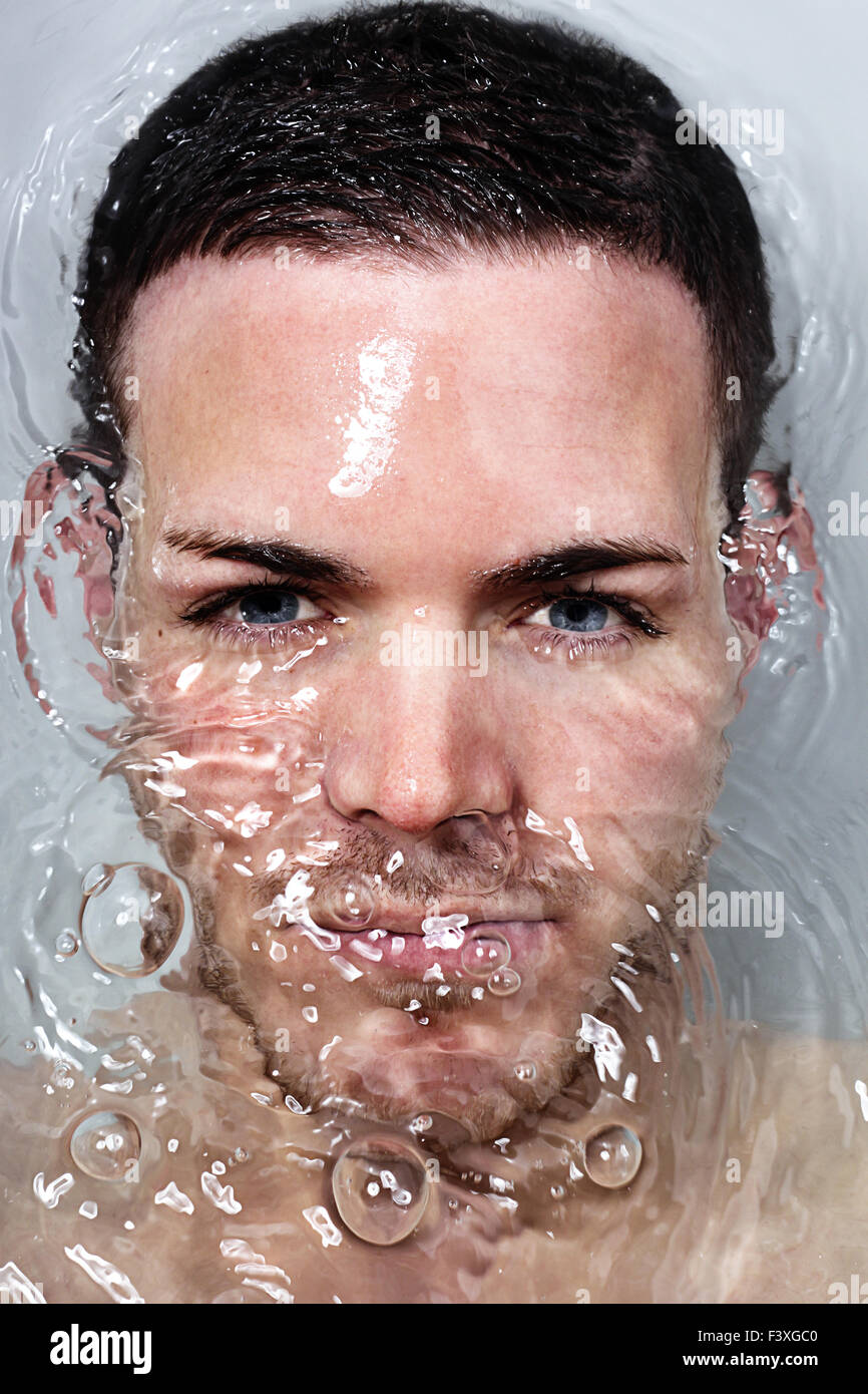 Portrait of a bautiful young man underwater Stock Photo - Alamy
