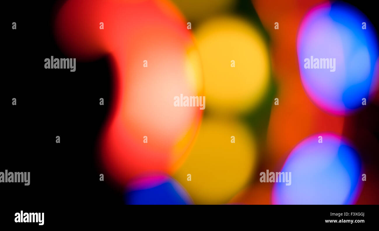 Abstract moving colorful lights on black background Stock Photo - Alamy