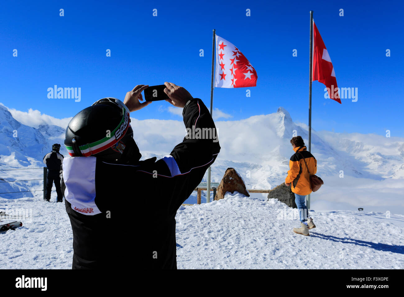 Flag of the Canton du Valais, and the Swiss national flag, Swiss Alps ...