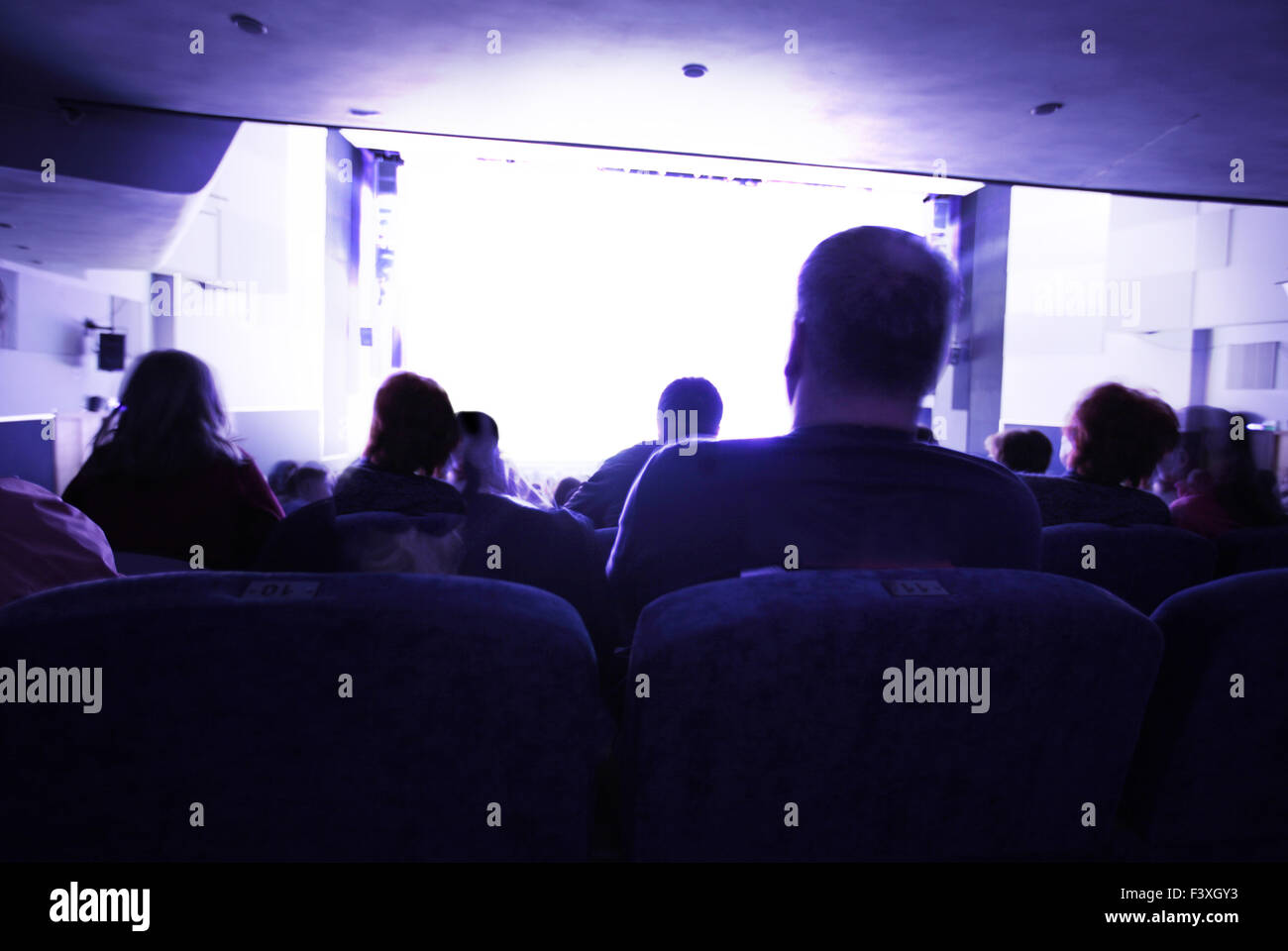 People Sitting In Theater Silhouette