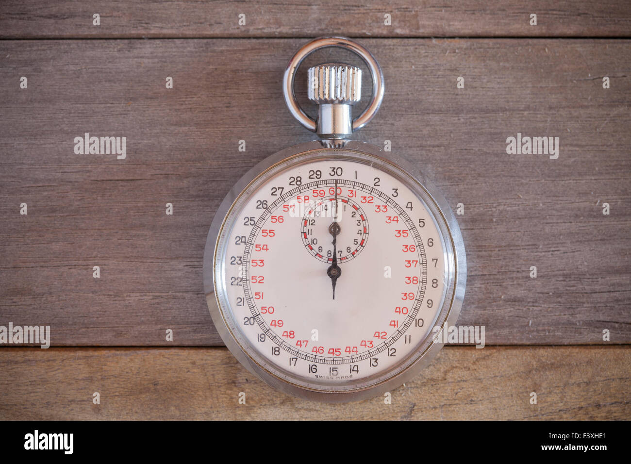 An old and vintage stopwatch over a wooden surface Stock Photo - Alamy