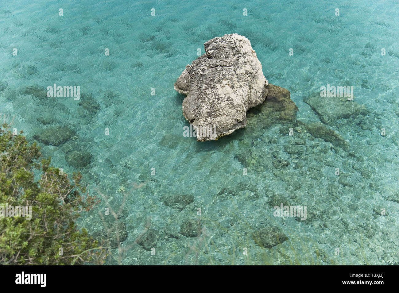 the rock in the sea Stock Photo - Alamy