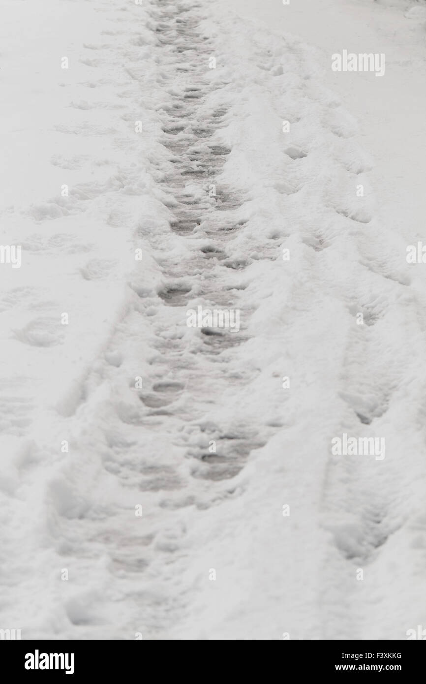 Footsteps on the snow in flat area Stock Photo - Alamy