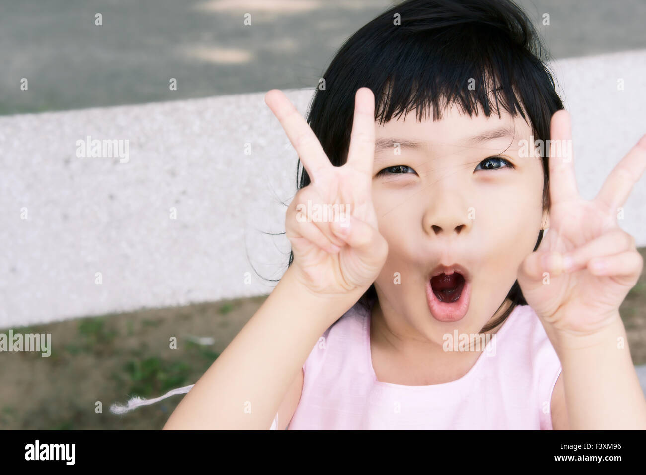 Girl in victory Stock Photo - Alamy