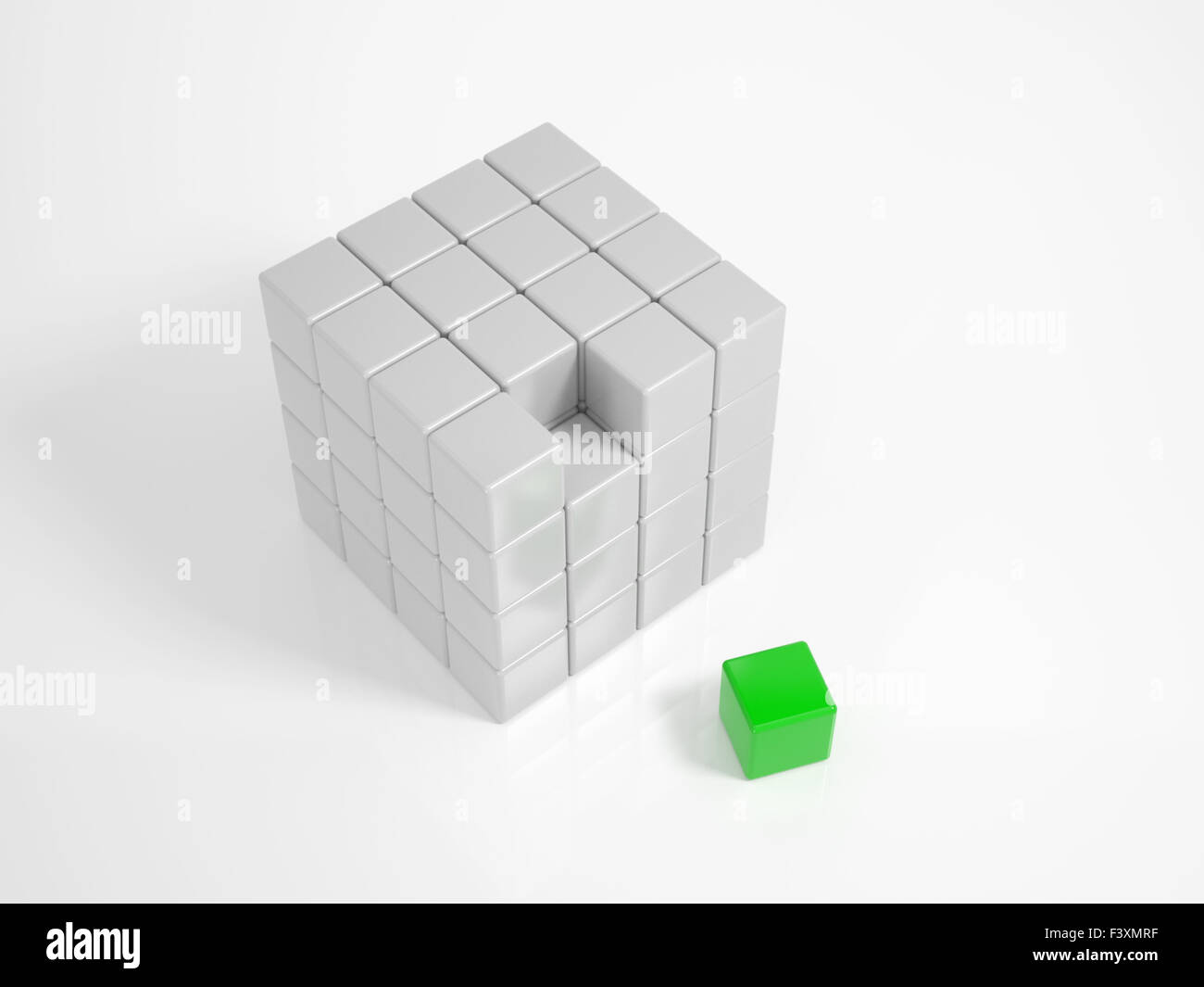 Green Cube is the missing piece Stock Photo - Alamy