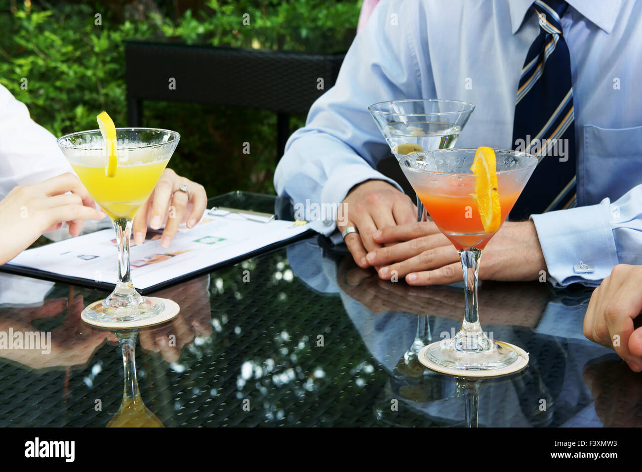 Business meeting over cocktail Stock Photo - Alamy