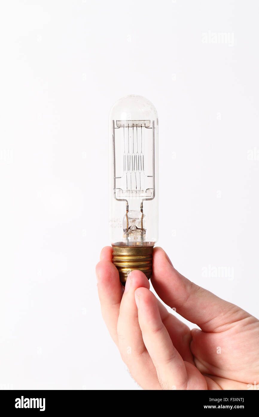 Light bulb in hand, isolated on white background Stock Photo - Alamy