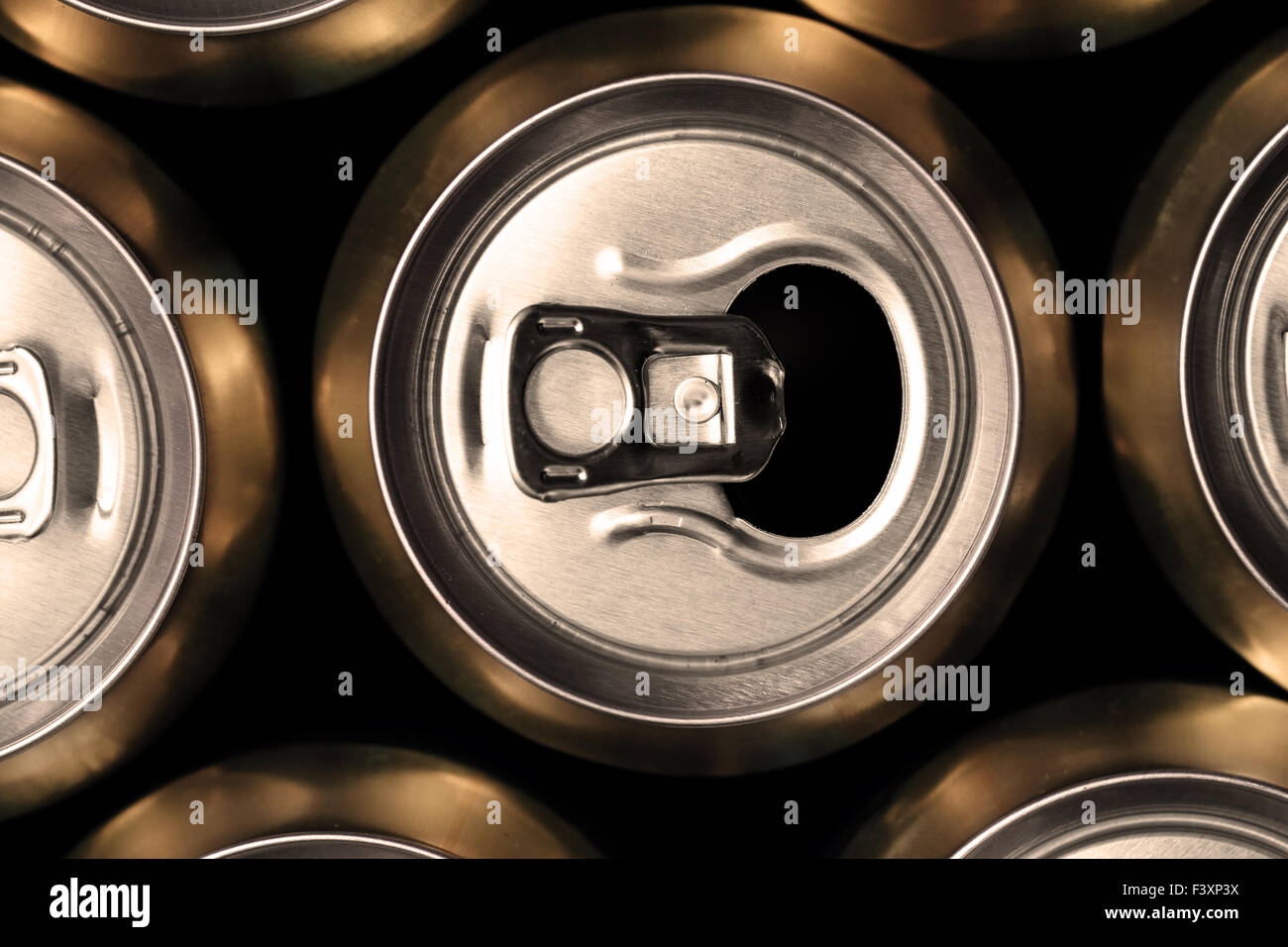 Much of yellow drinking cans close up Stock Photo - Alamy