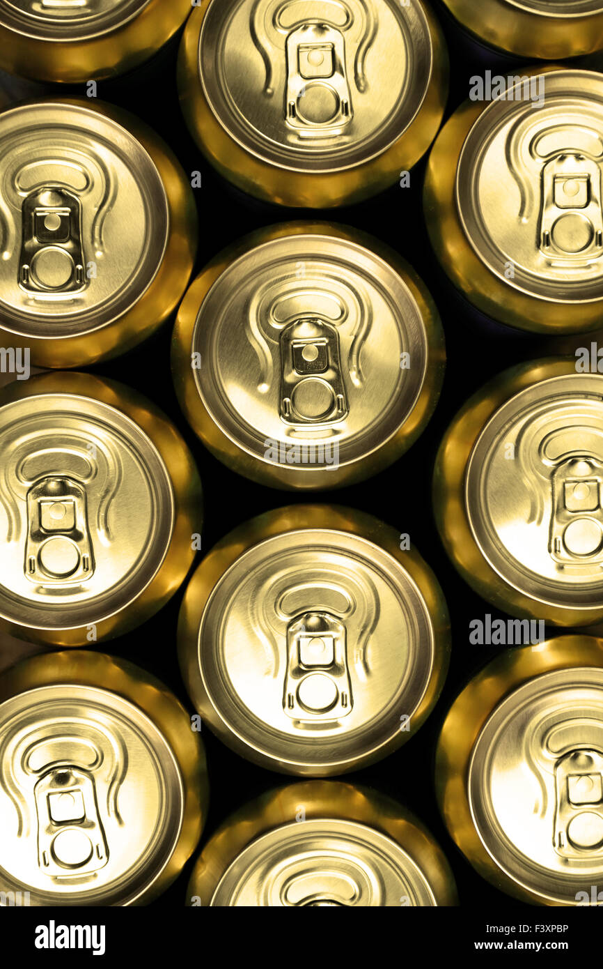 Much of yellow drinking cans close up Stock Photo - Alamy