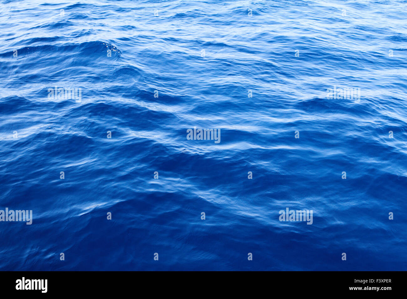 Photo of blue water background with ripples Stock Photo - Alamy