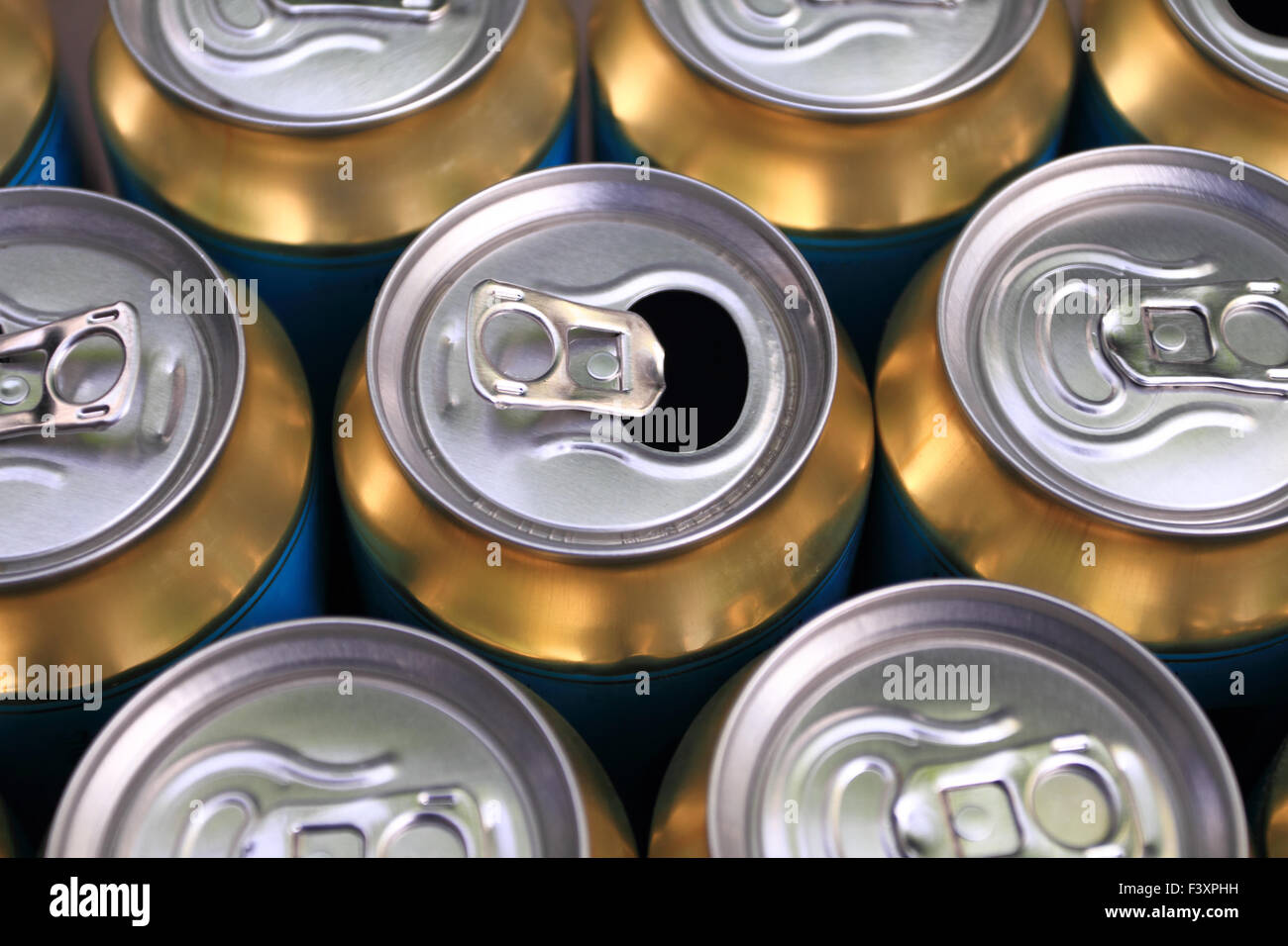 Much of yellow drinking cans close up Stock Photo - Alamy
