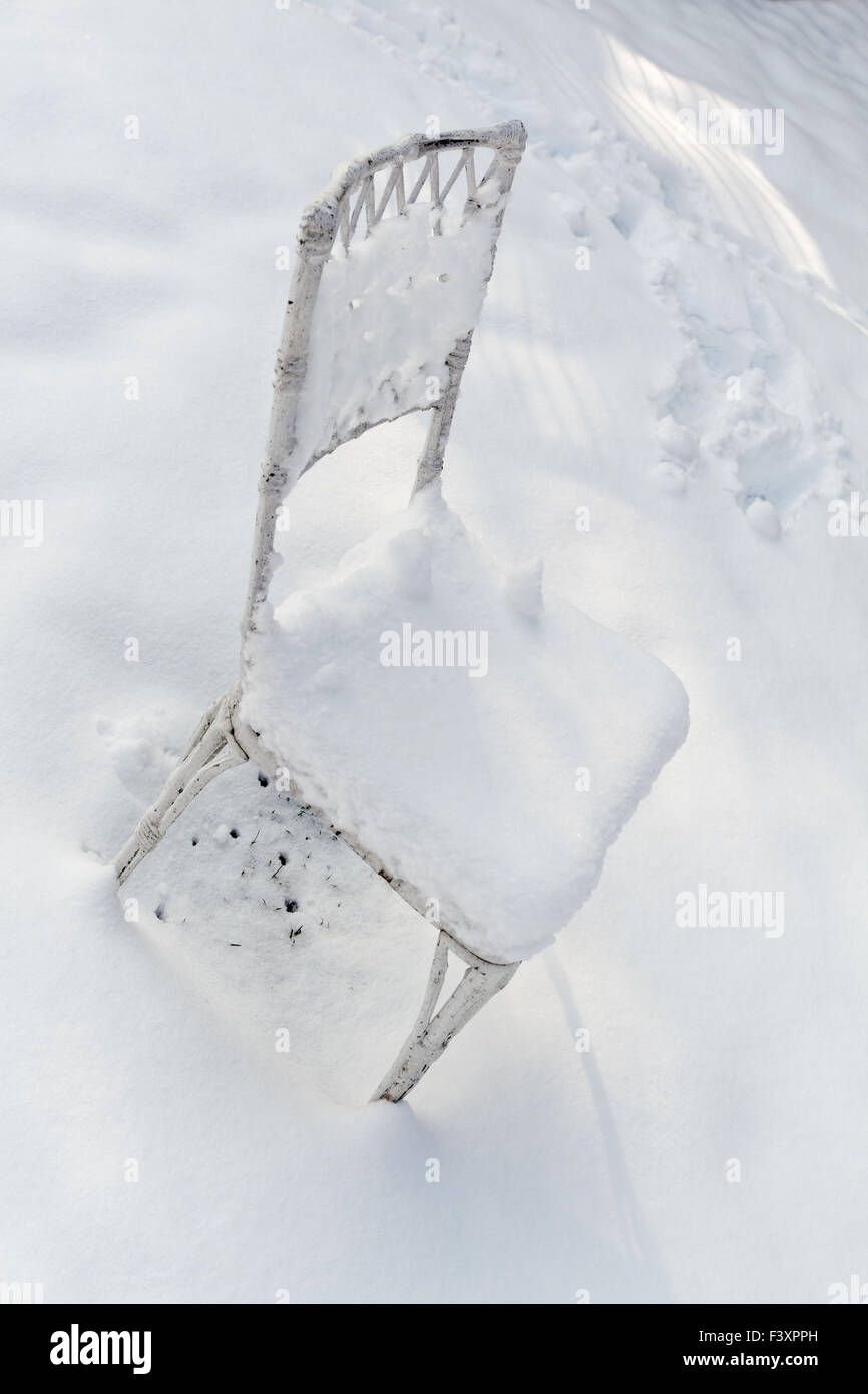 Chair in park covered with snow Stock Photo - Alamy