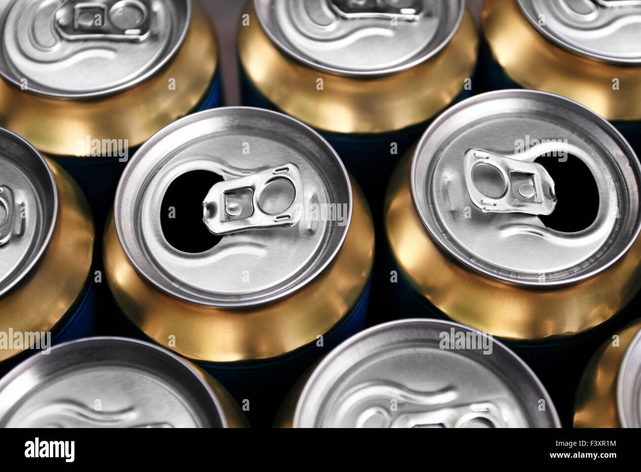 Much of yellow drinking cans close up Stock Photo - Alamy
