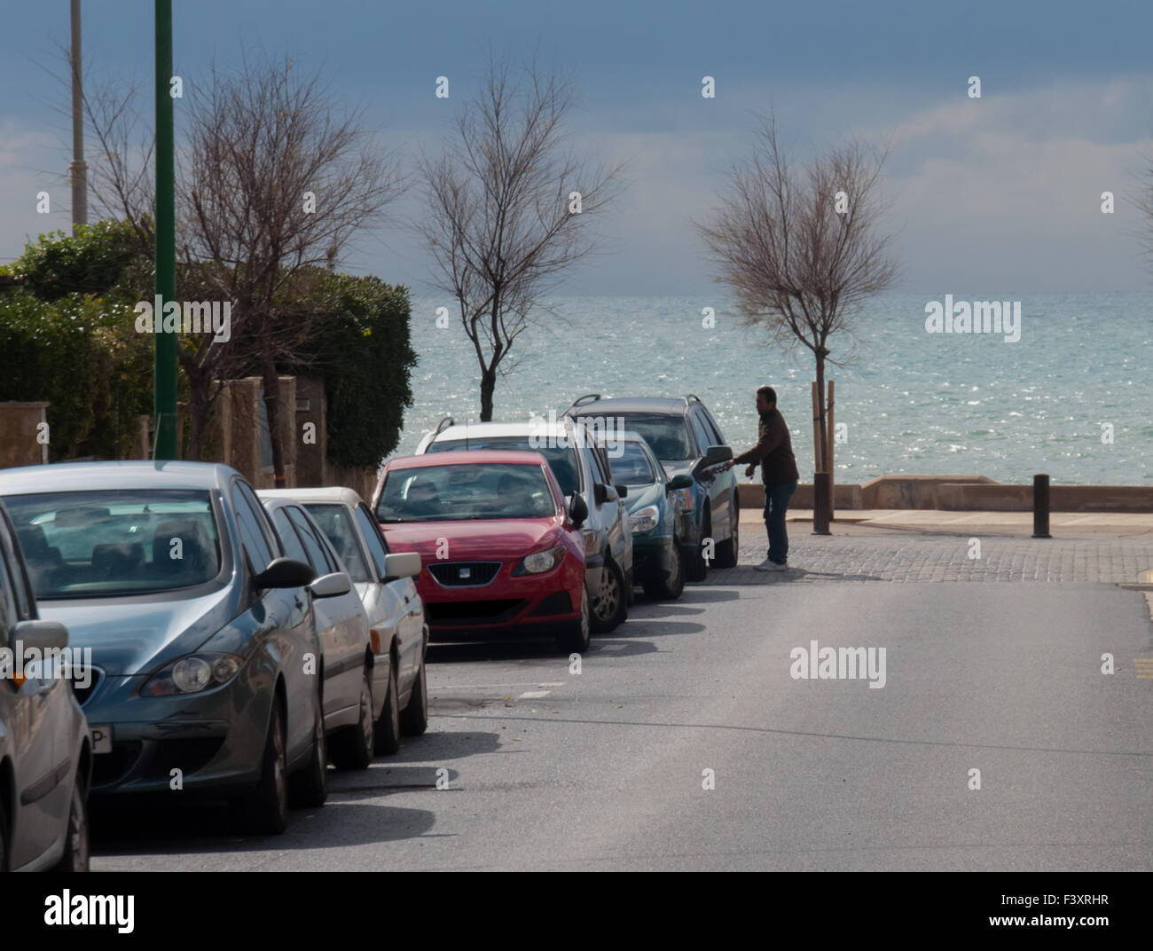 Parked cars and Mediterranean ocean Stock Photo - Alamy