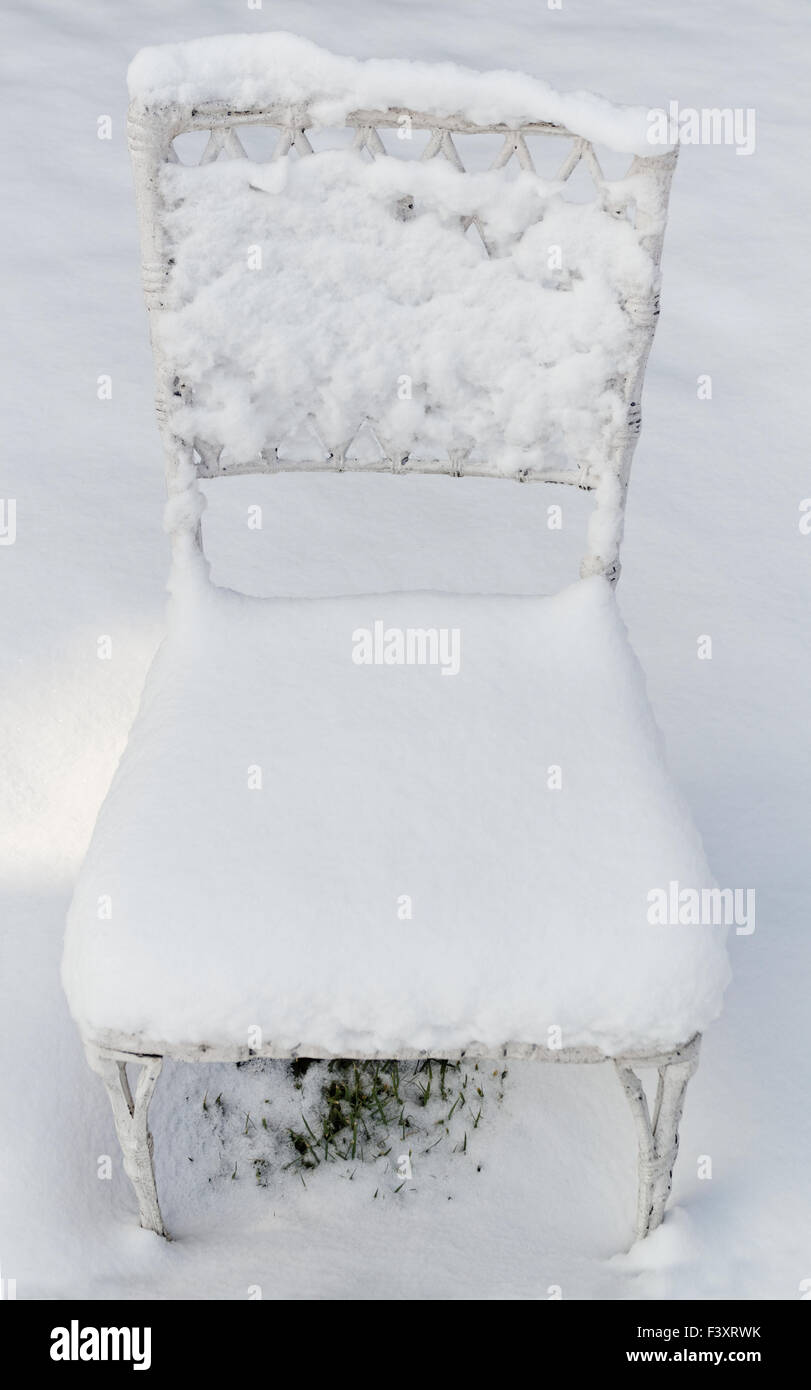 Chair in park covered with snow Stock Photo - Alamy
