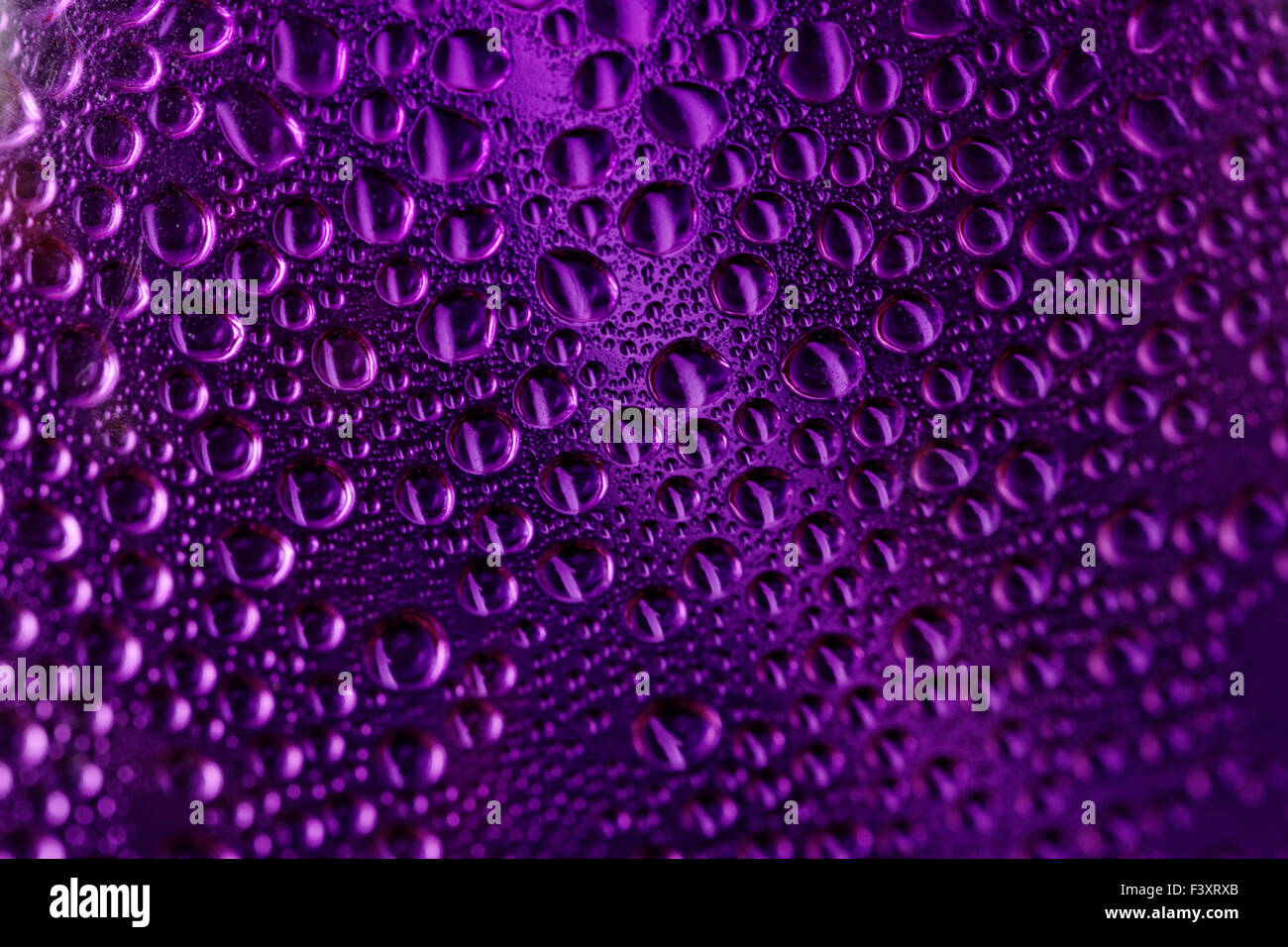 Background of beautiful purple water drops Stock Photo - Alamy