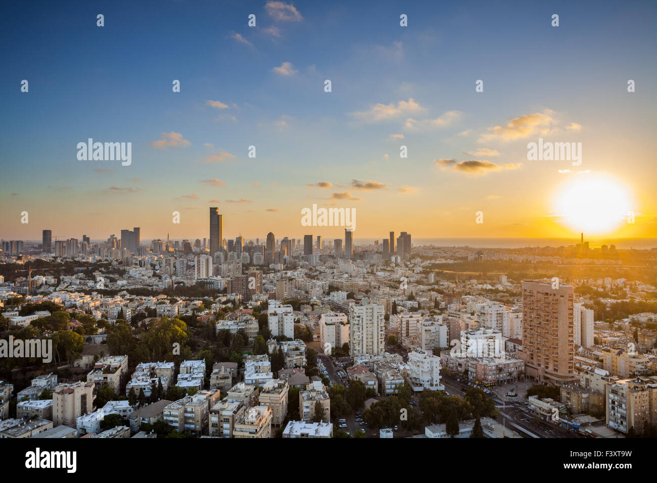 Cityscape at sunset Stock Photo - Alamy