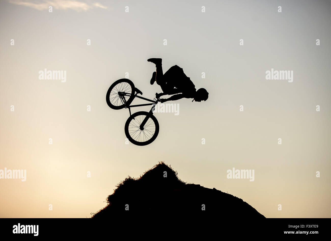 Extreme rider making a bike jump Stock Photo - Alamy