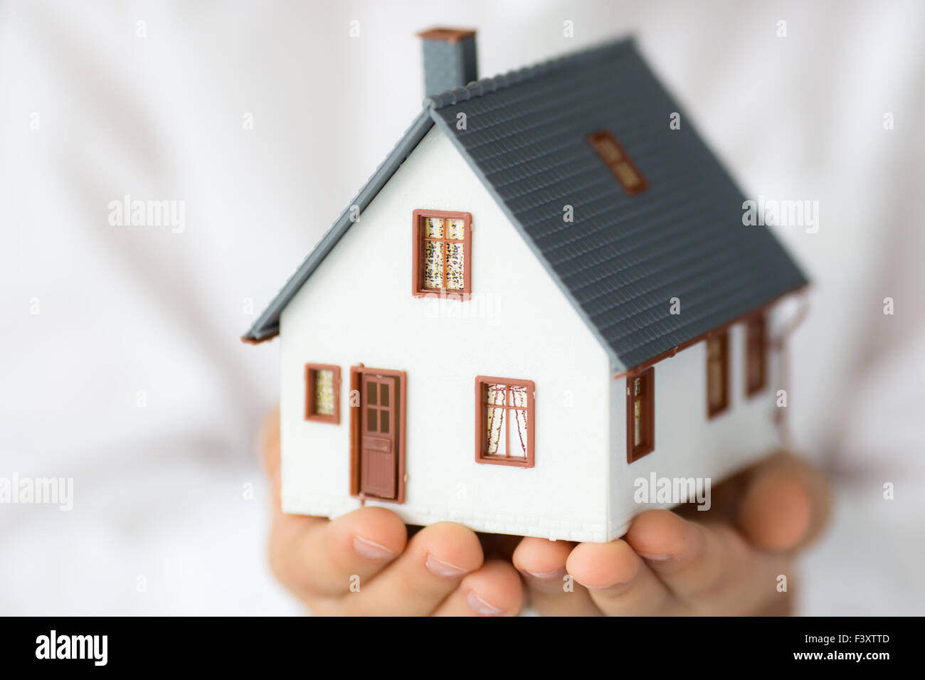 Child holding model house hi-res stock photography and images - Alamy