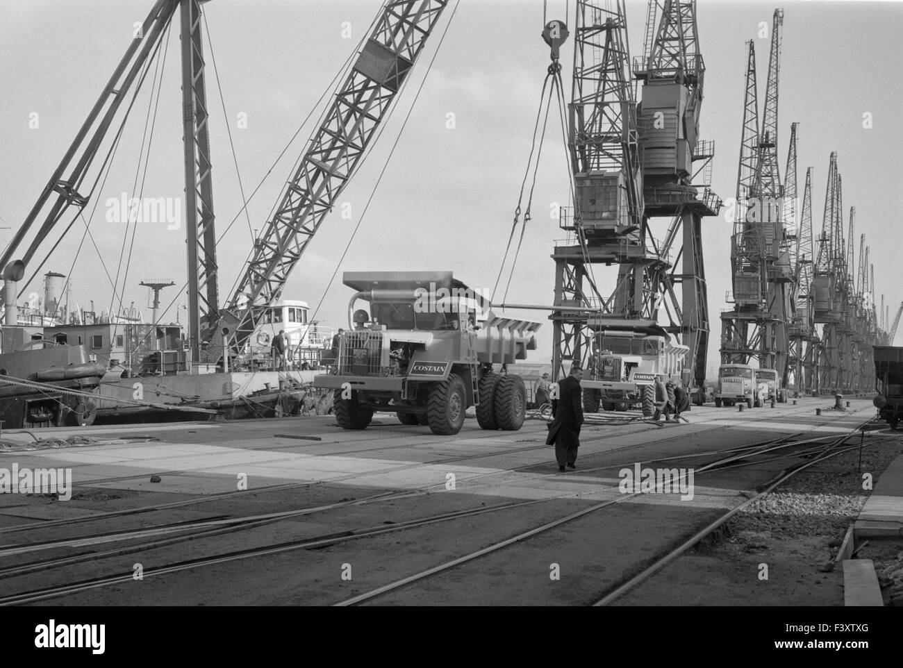 Loading Dumper Trucks on to ship for export, 1972 Stock Photo - Alamy
