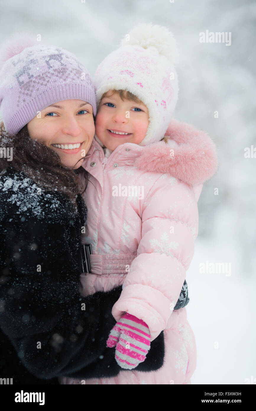 Happy girl in winter park, smiling portrait of a young female wearing ...