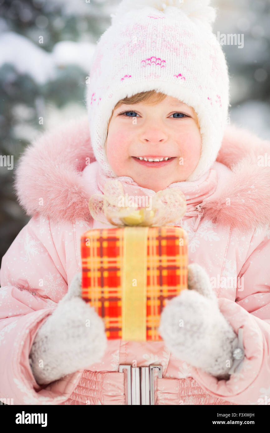 Happy child holding gift box Stock Photo - Alamy