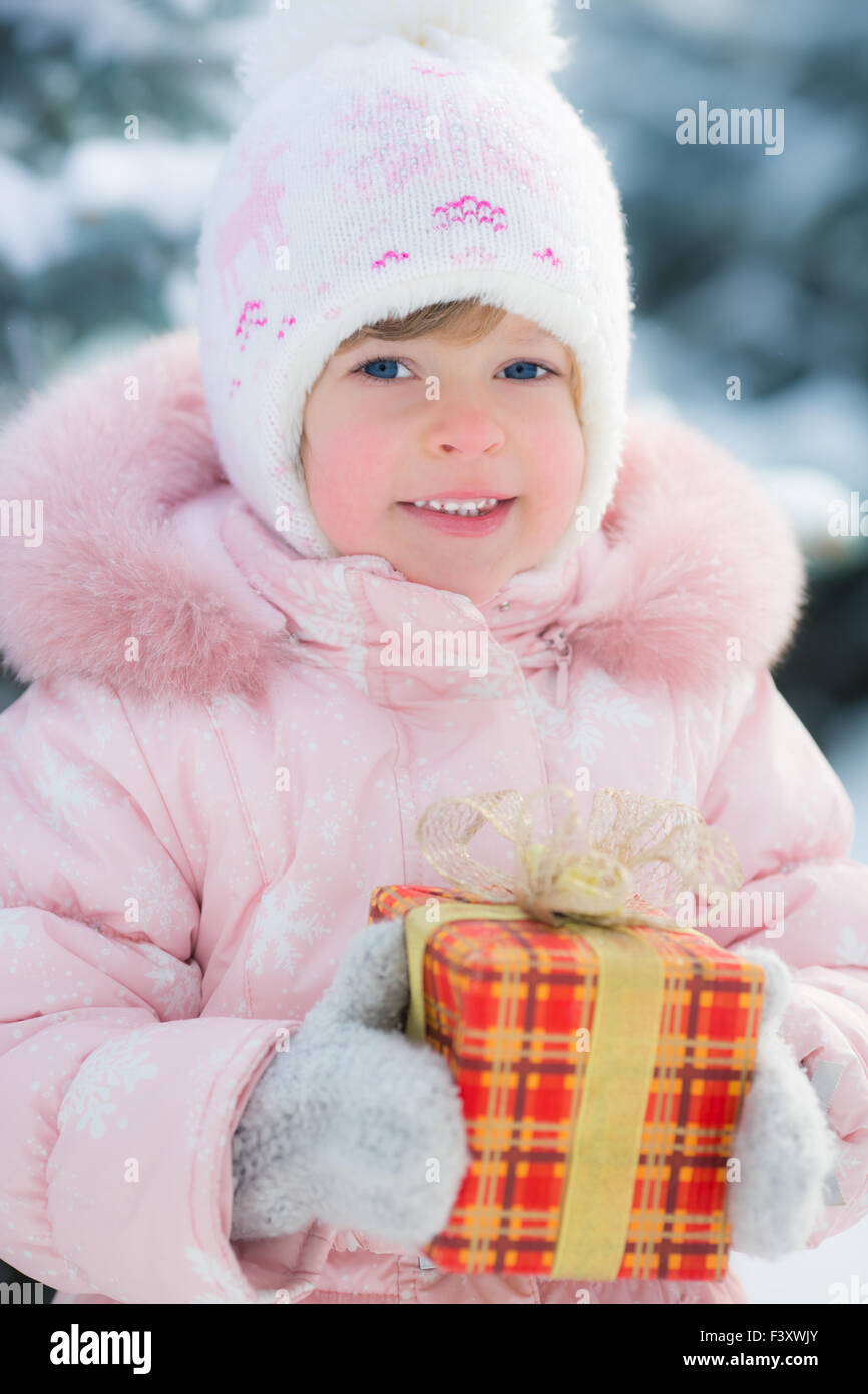 Happy child holding gift box Stock Photo - Alamy