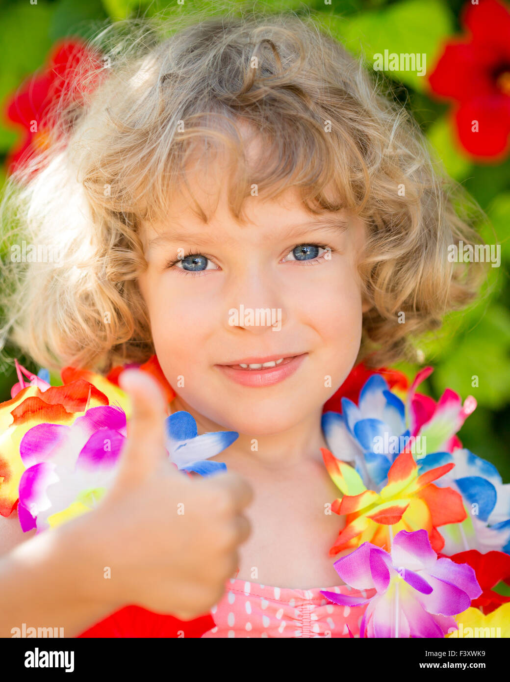 Happy child showing thumb up Stock Photo - Alamy