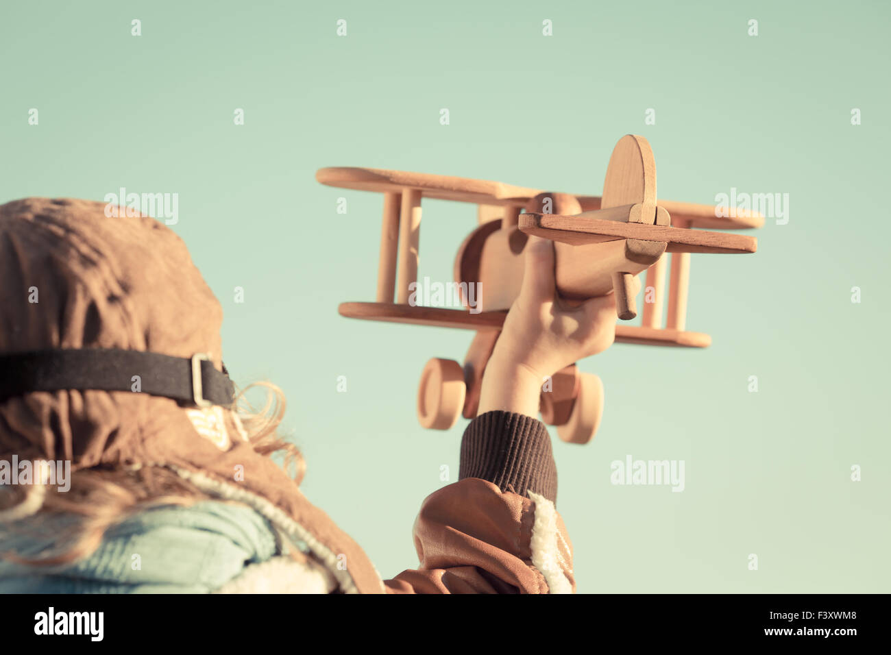 Kid playing with toy airplane Stock Photo - Alamy