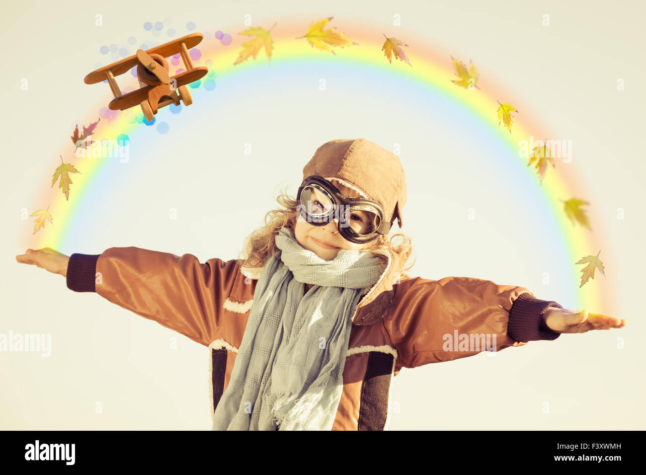 Happy kid playing with toy airplane Stock Photo - Alamy