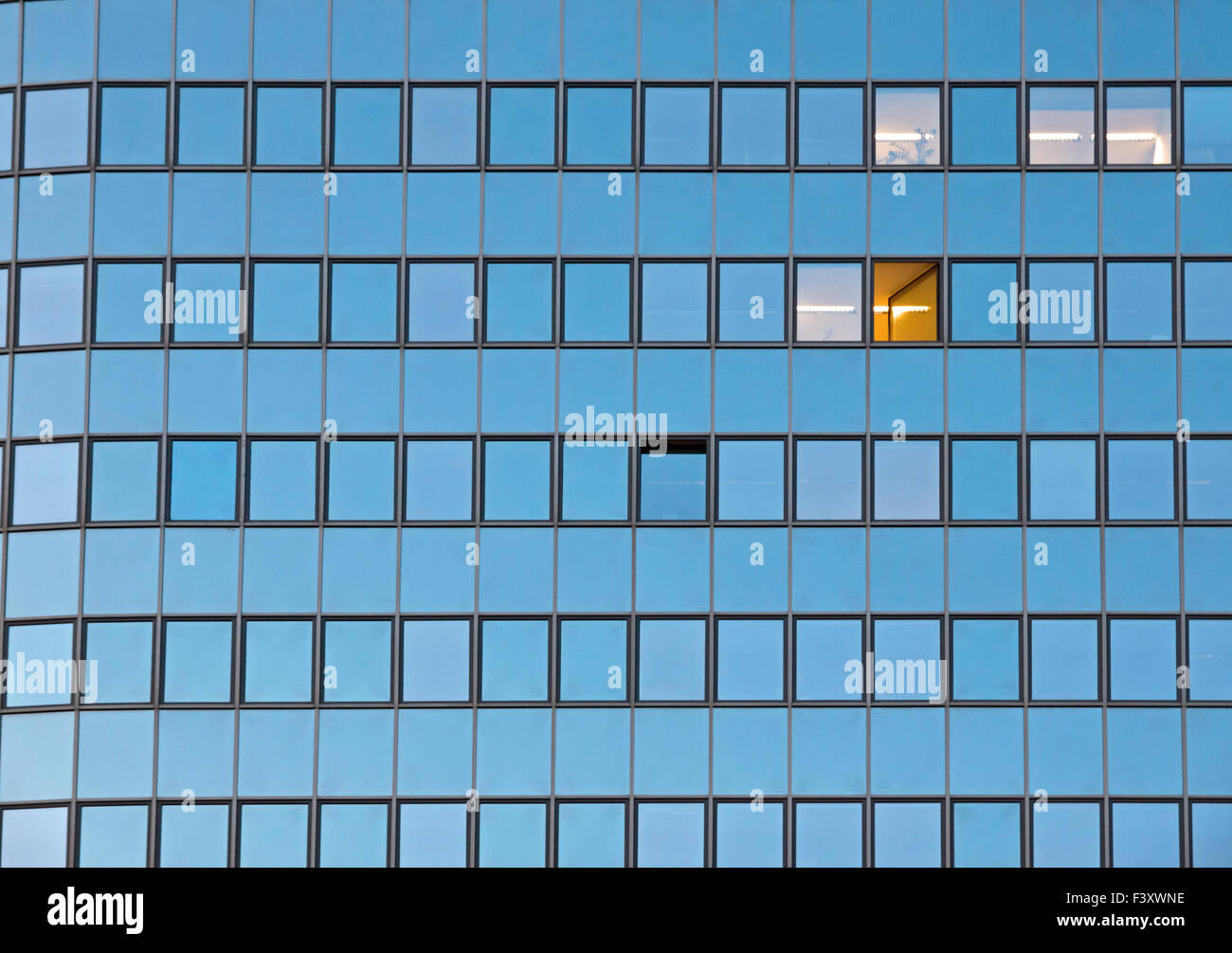 Facade of an office building with one open window Stock Photo - Alamy