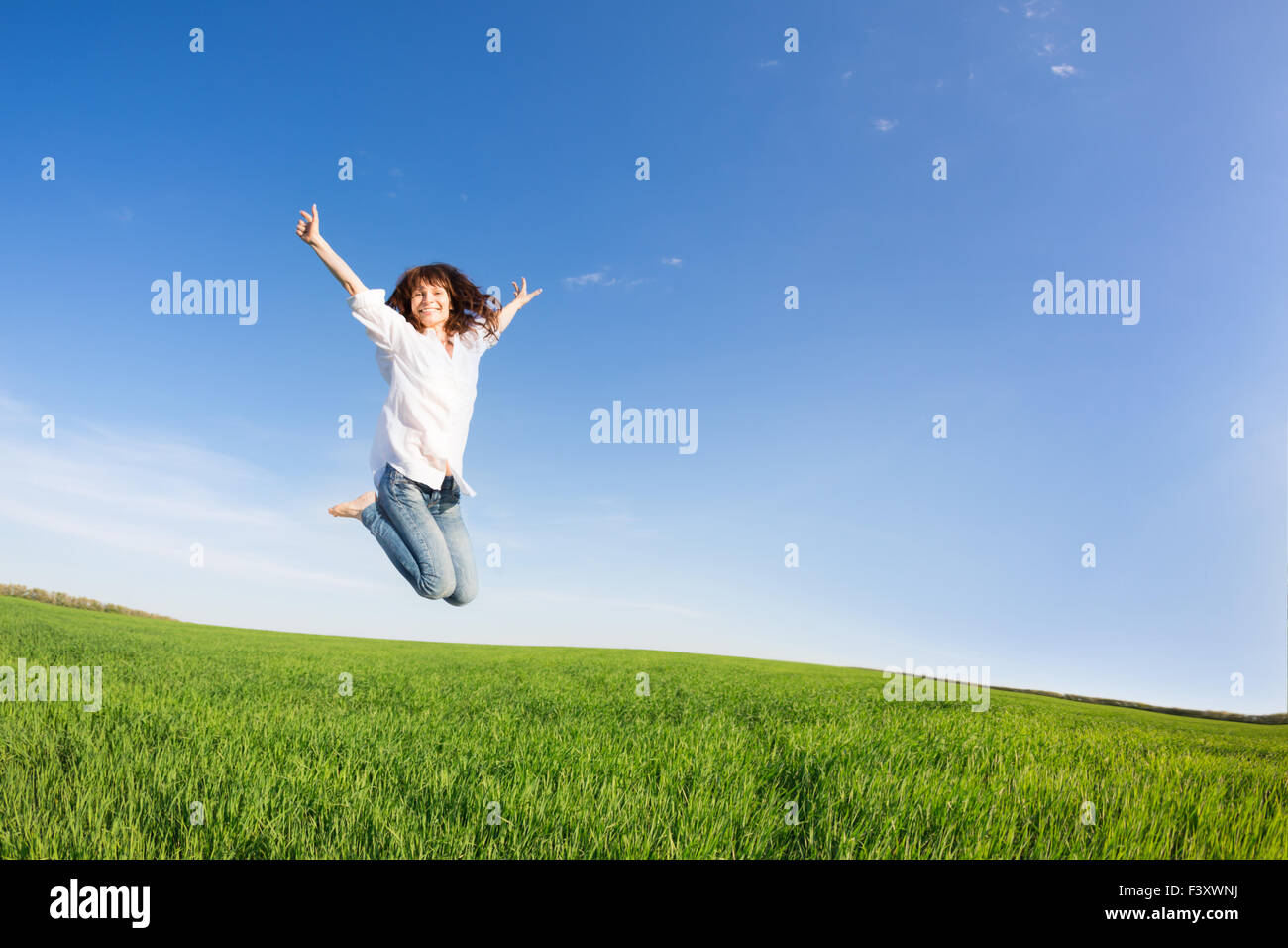 Woman winner jump fitness hi-res stock photography and images - Alamy