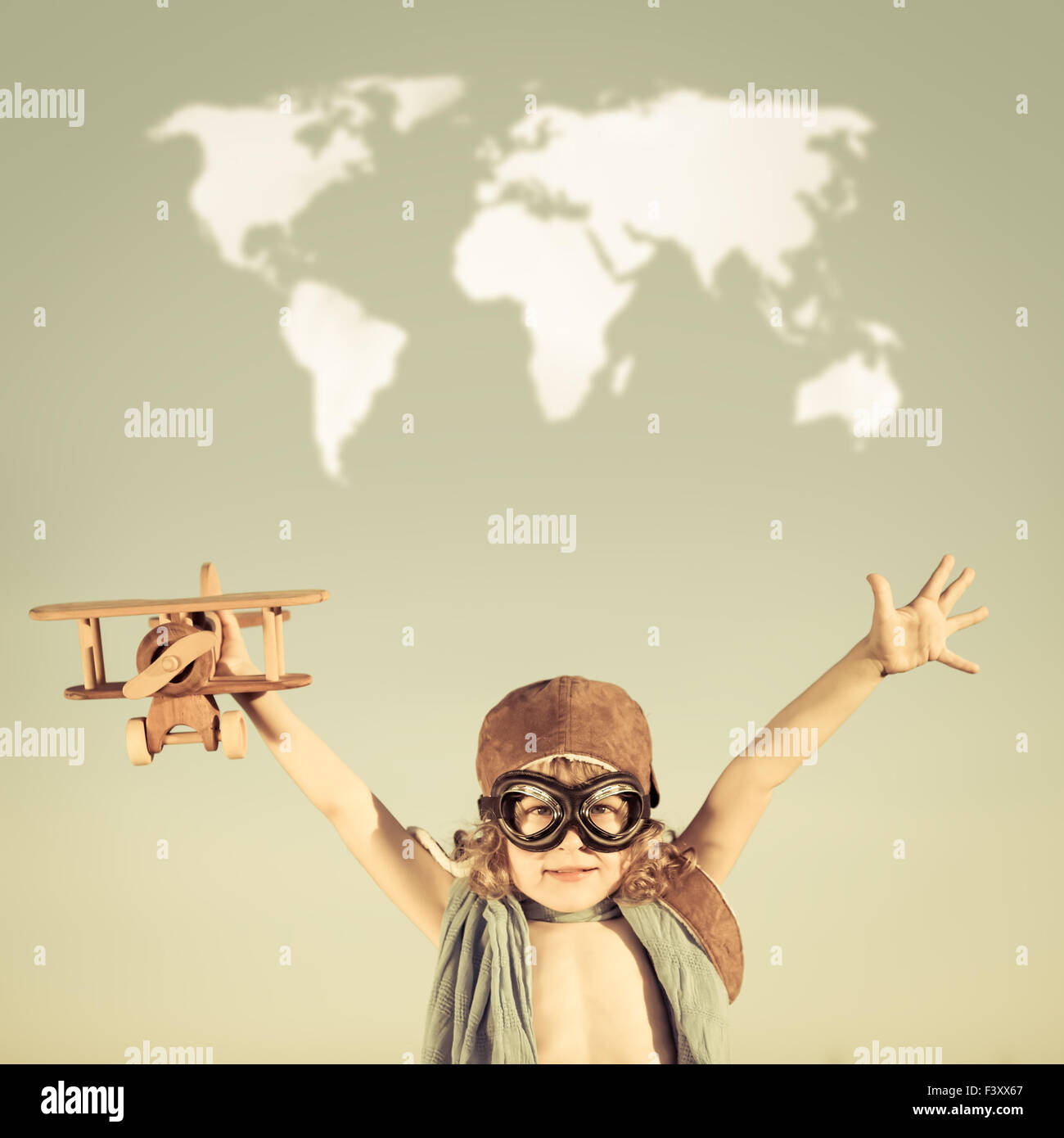 Happy kid playing with toy airplane Stock Photo - Alamy