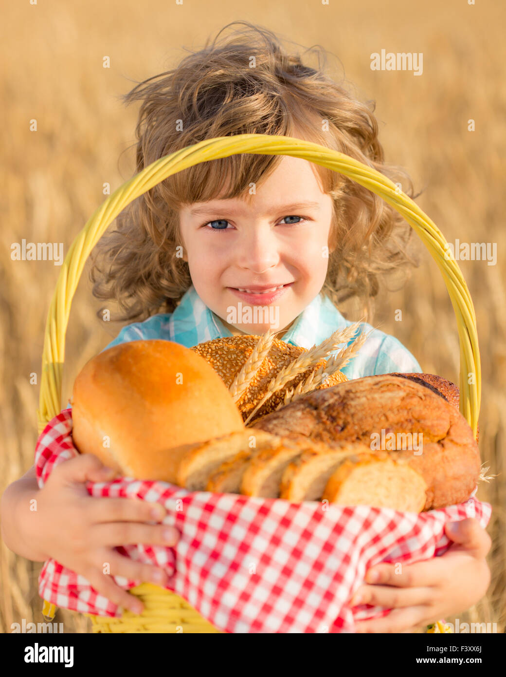 Child holding bread in basket Stock Photo - Alamy