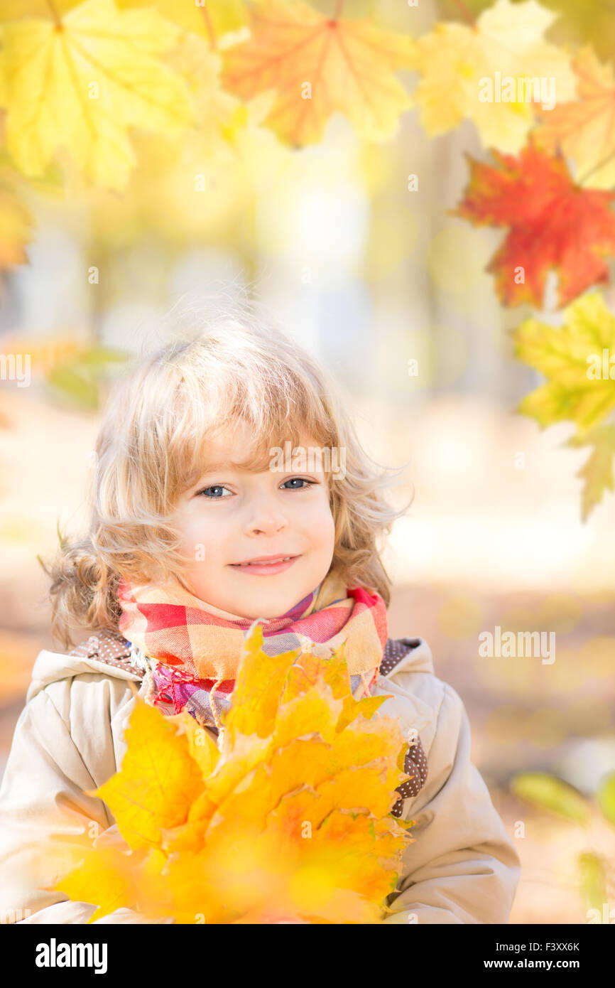 Child in autumn park Stock Photo - Alamy