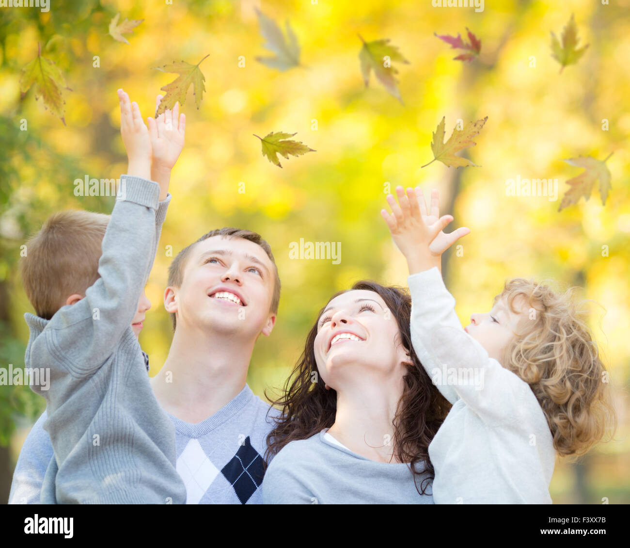Family having fun in autumn Stock Photo - Alamy