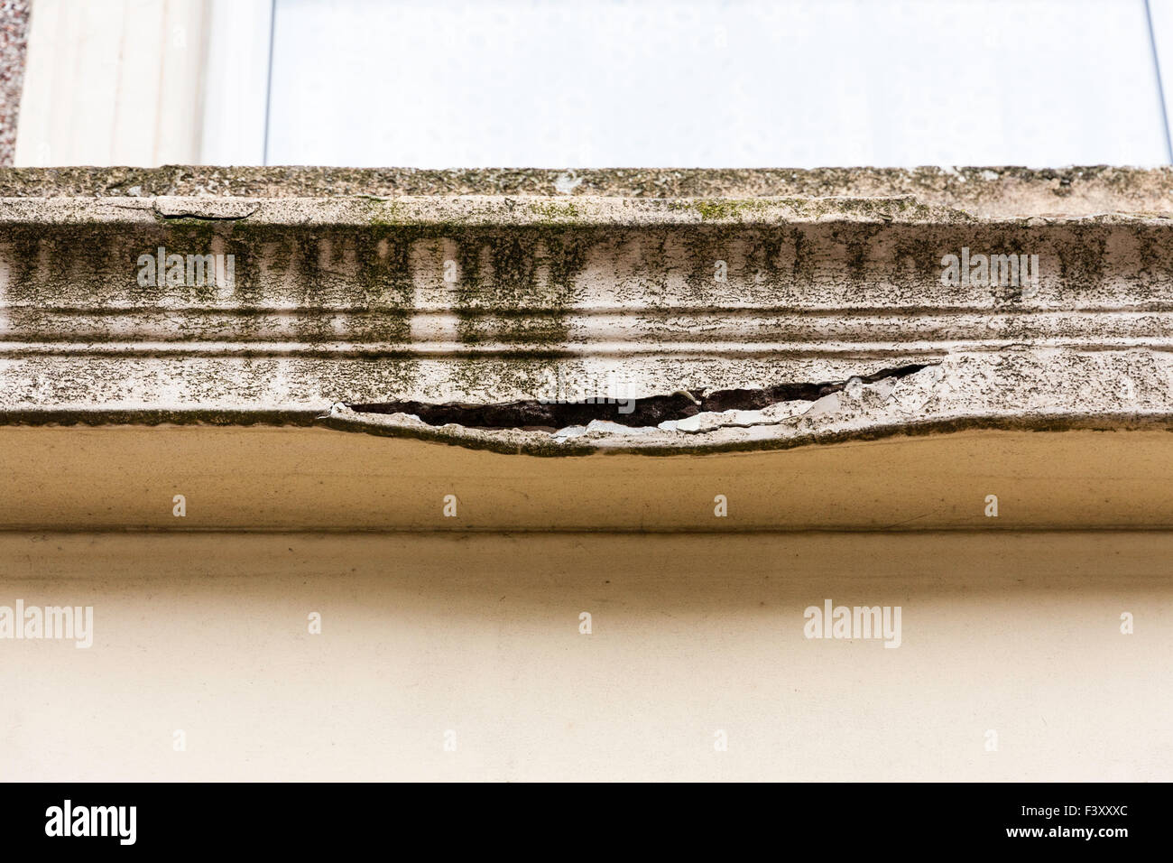 Water damage above bay window on private English house, showing the ...