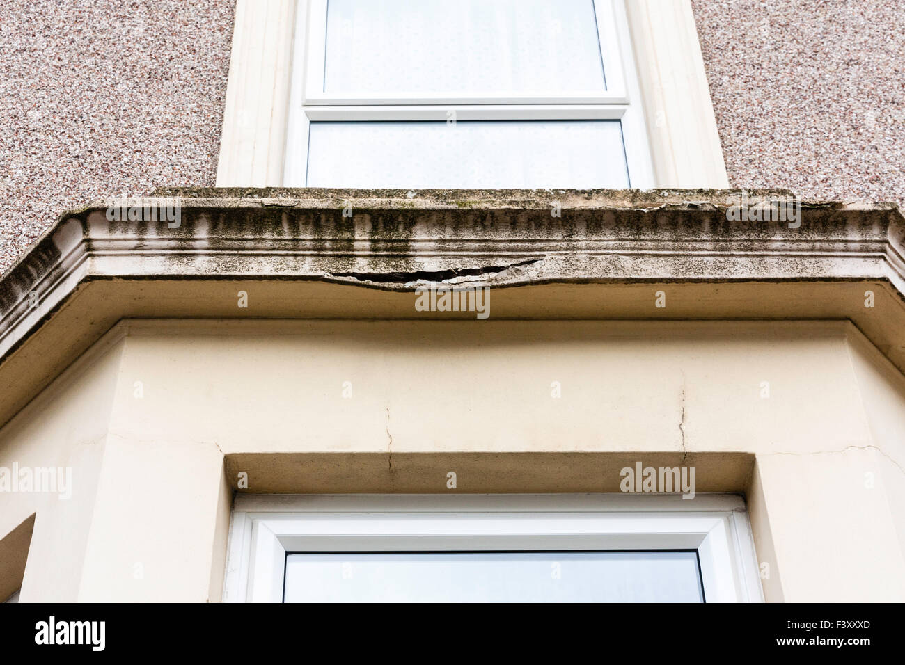 Water damage above bay window on private English house, showing the ...