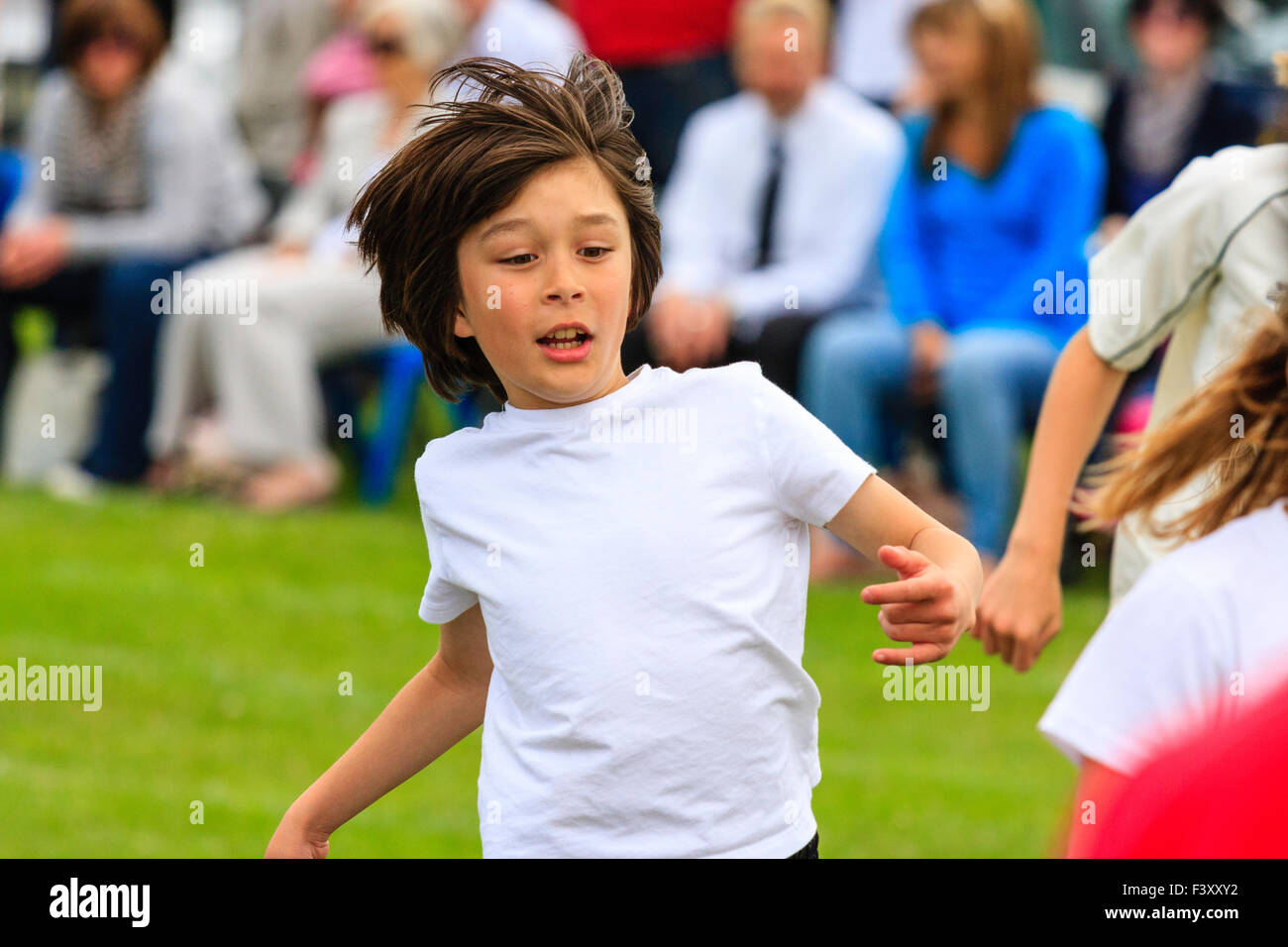England, school child, boy, 10-11 year old, running race on outdoor ...