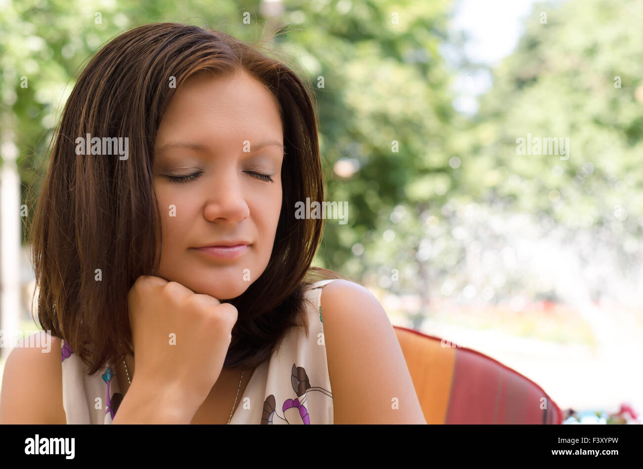 Woman daydreaming in peaceful garden Stock Photo - Alamy