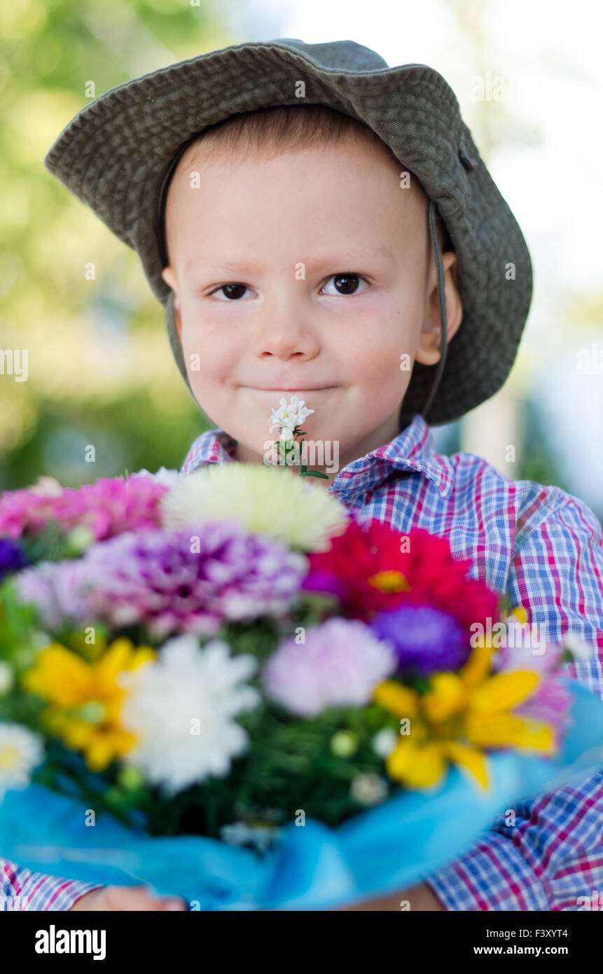 Little boy with flowers for Mum Stock Photo - Alamy