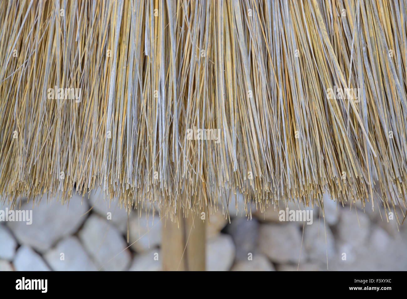 Straw parasol closeup Stock Photo - Alamy